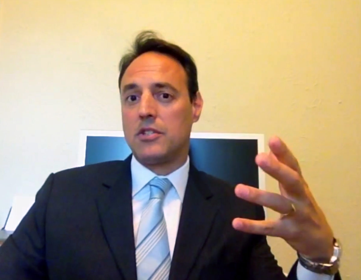 Matthew Sparke sits at the head of a table in a first-floor | Seattle ...